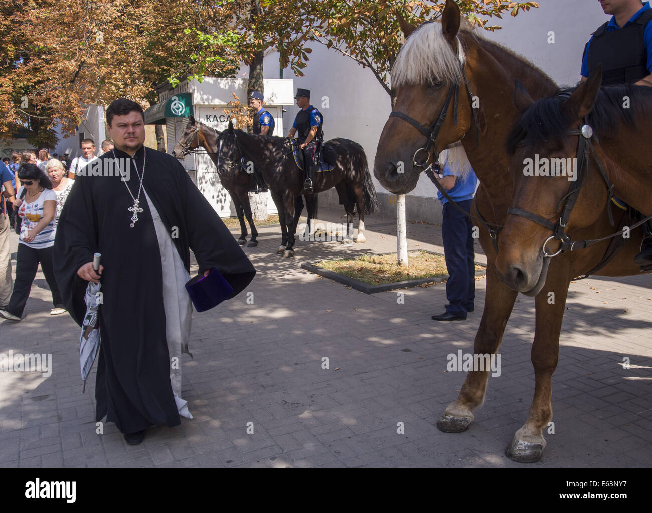 Priest walks past hi-res stock photography and images - Alamy