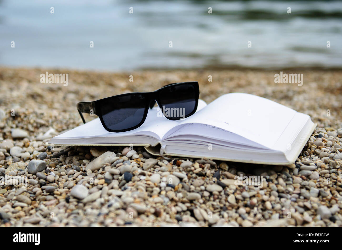 Open book at the beach near the sea Stock Photo - Alamy
