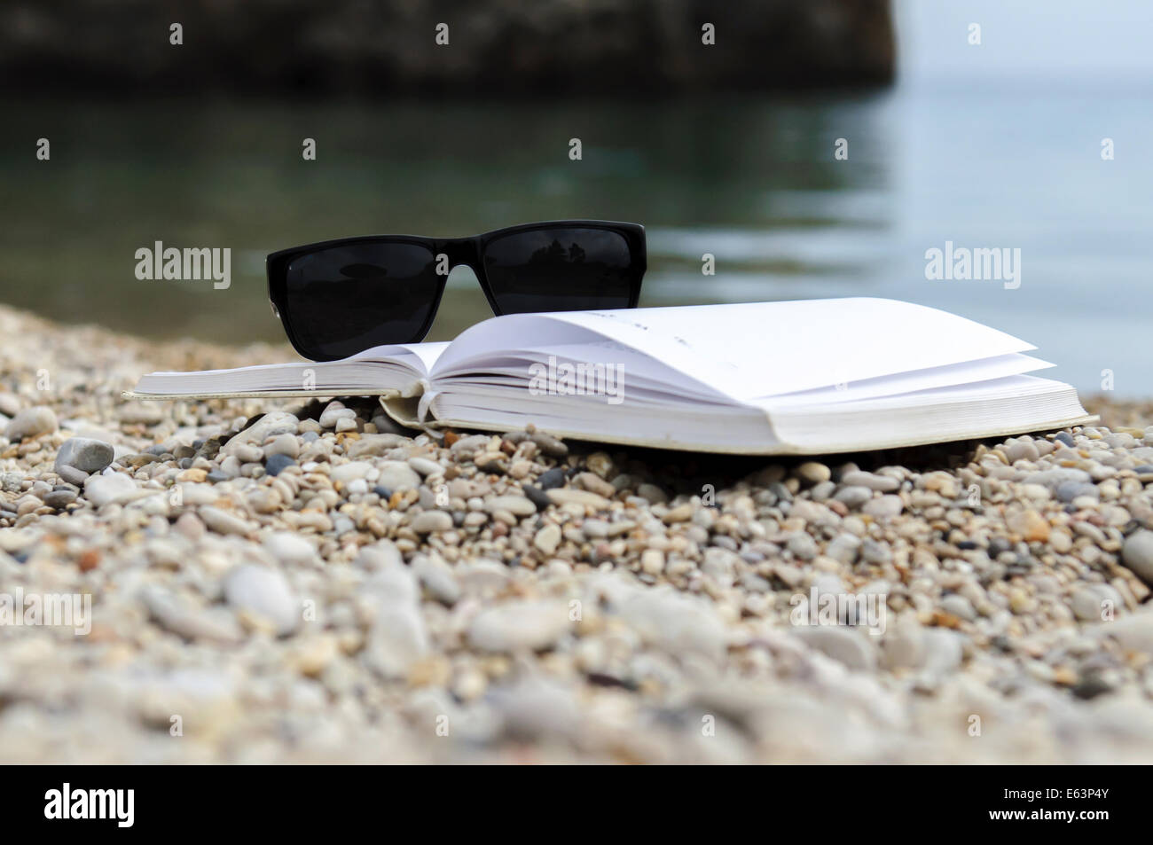 Open book at the beach near the sea Stock Photo - Alamy