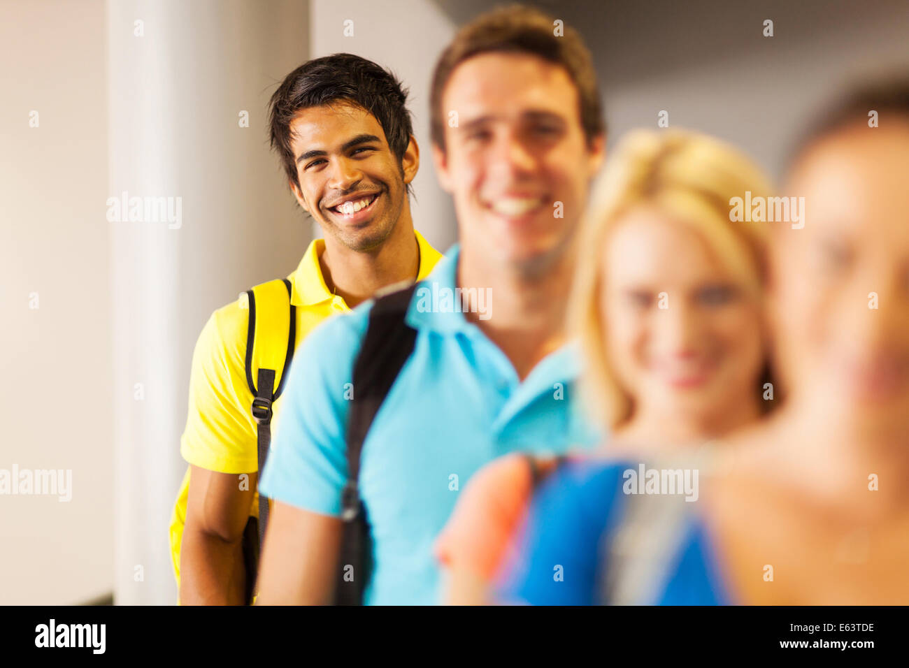 cheerful Indian male student standing in a row Stock Photo - Alamy
