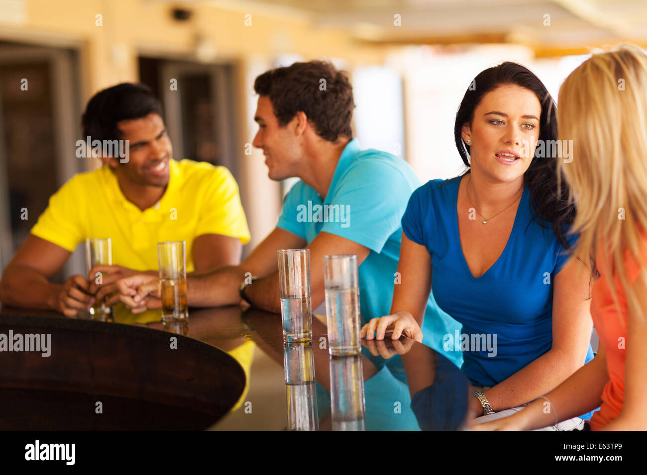 group of friends chilling at the bar Stock Photo - Alamy