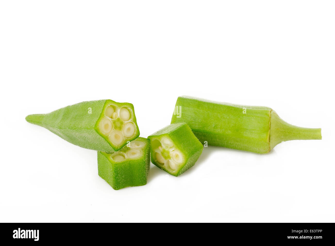 Okra on white background Stock Photo - Alamy