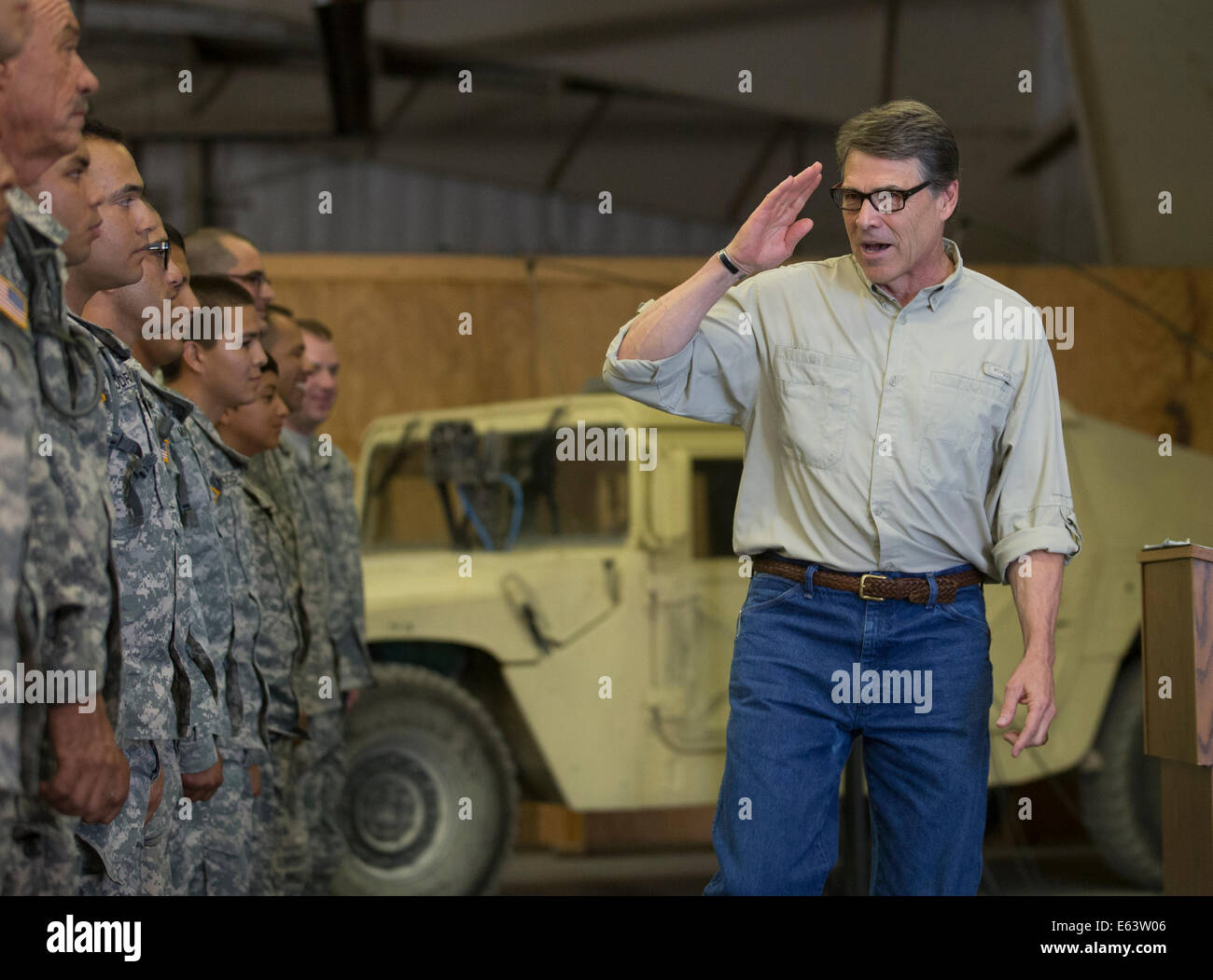 Gov Rick Perry salutes Texas National Guard soldiers as he views ...