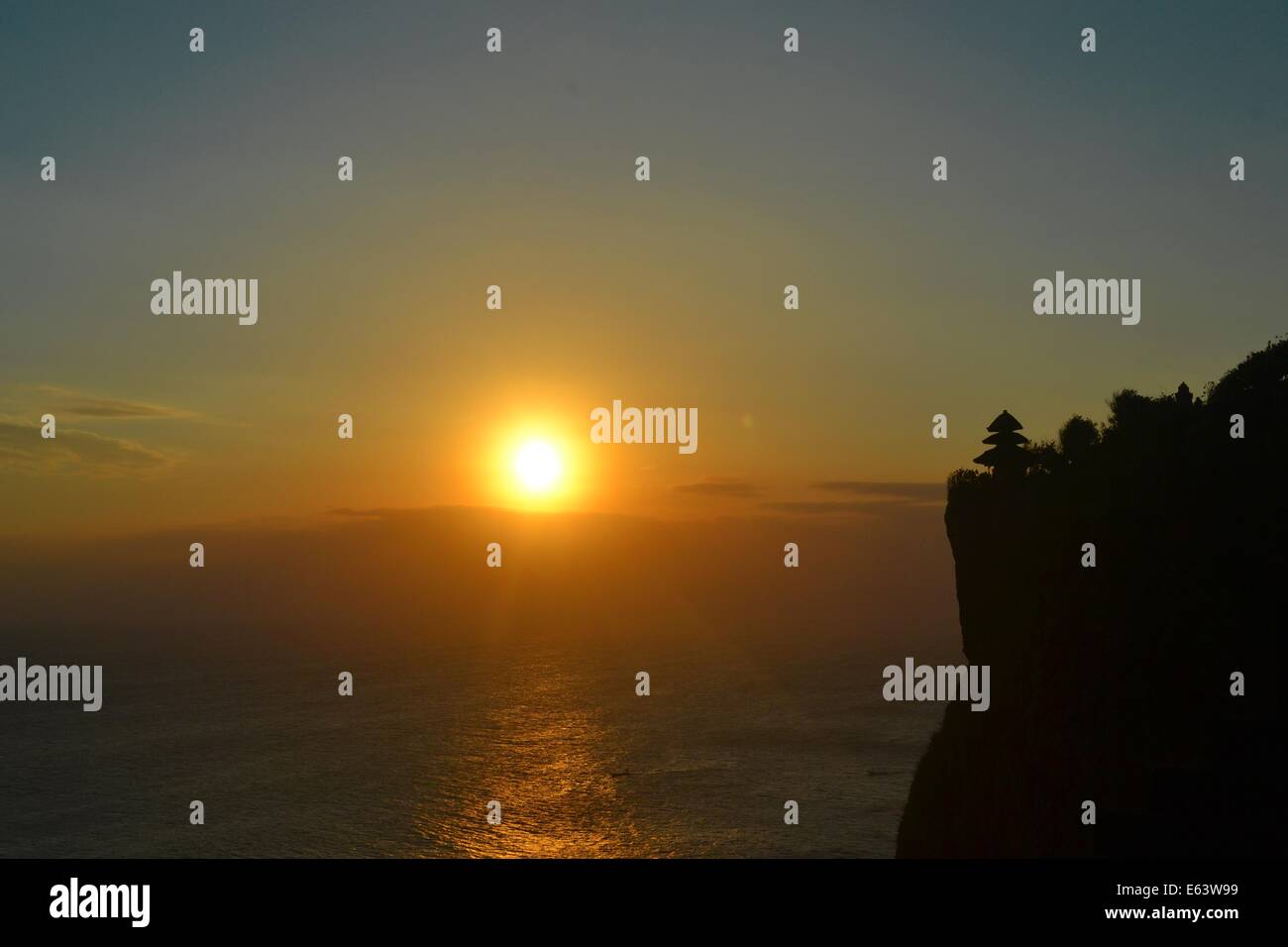 sunset at uluwatu temple, bali Stock Photo - Alamy