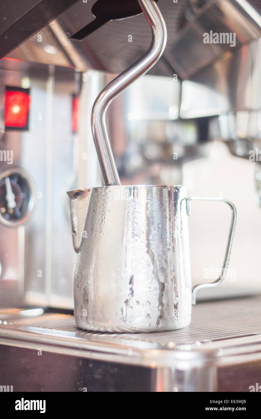 Pitcher for steaming milk, stock photo Stock Photo - Alamy