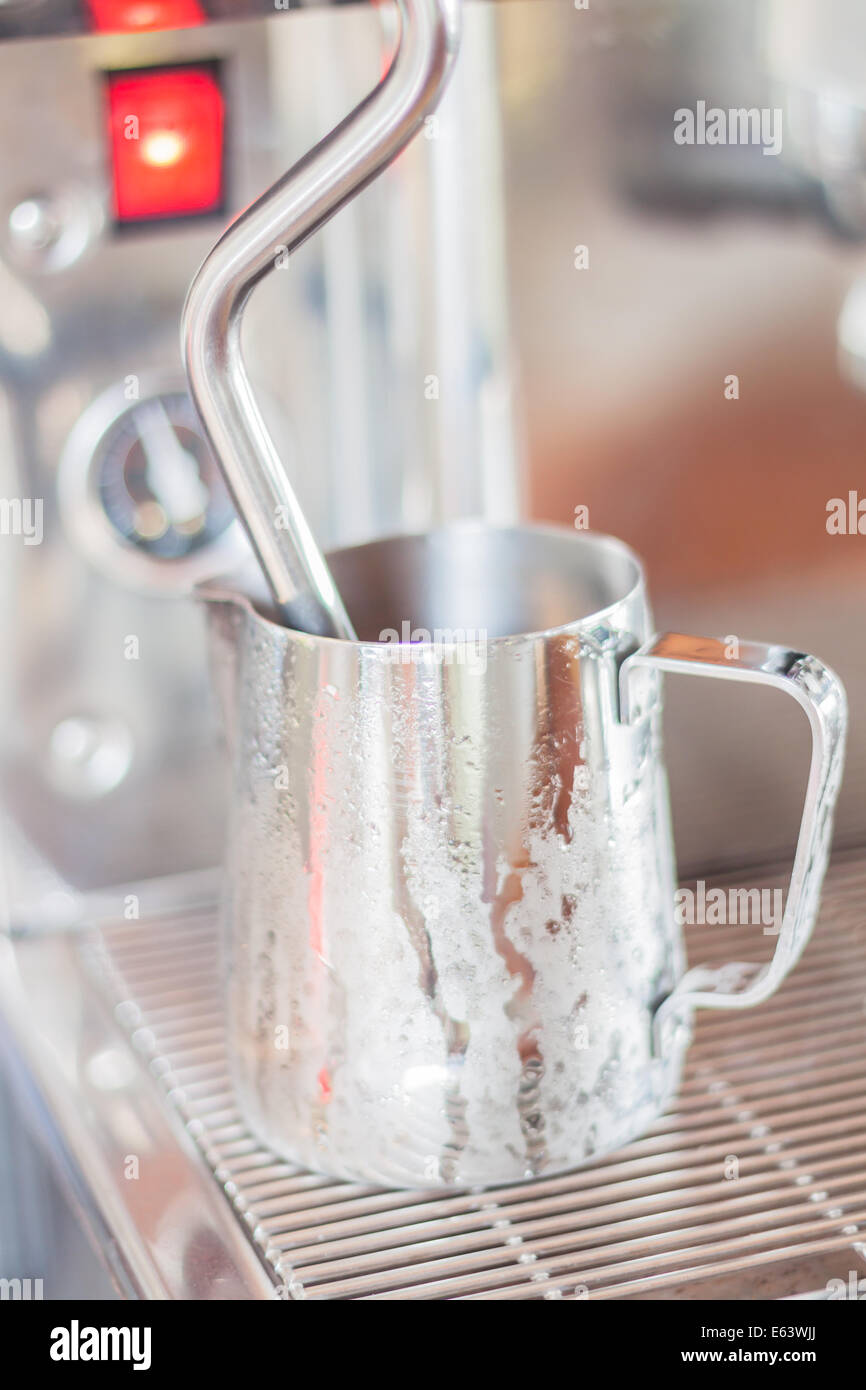 Prepares pitcher for steaming milk, stock photo Stock Photo - Alamy