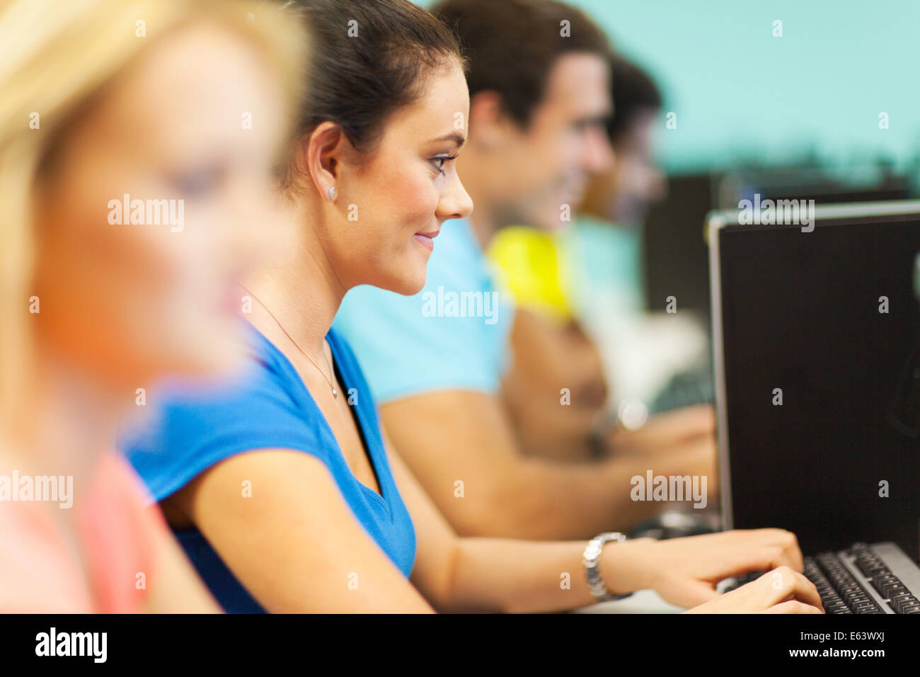 group of university students using computer in computer lab Stock Photo ...