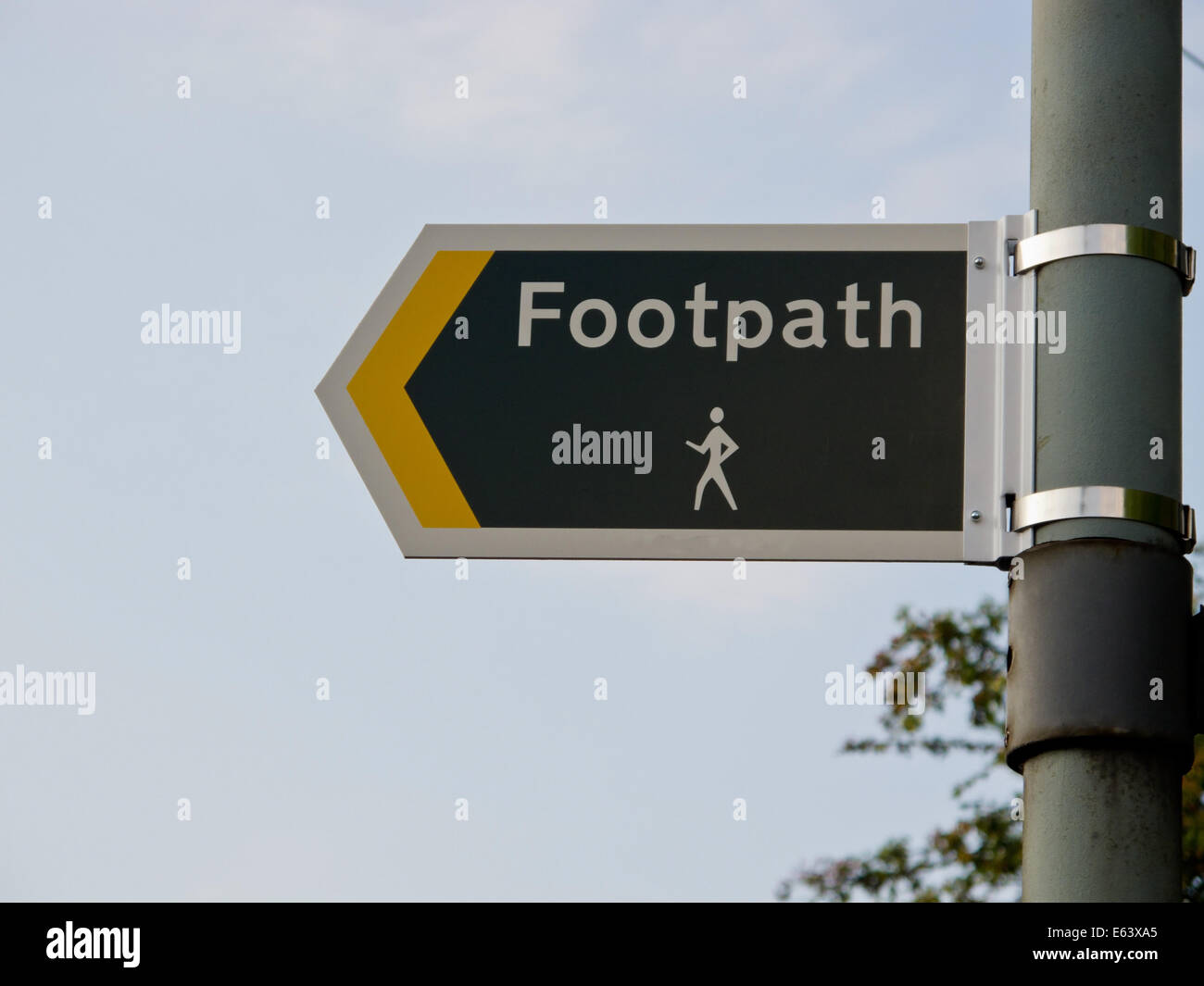 A sign showing a public footpath route Stock Photo - Alamy