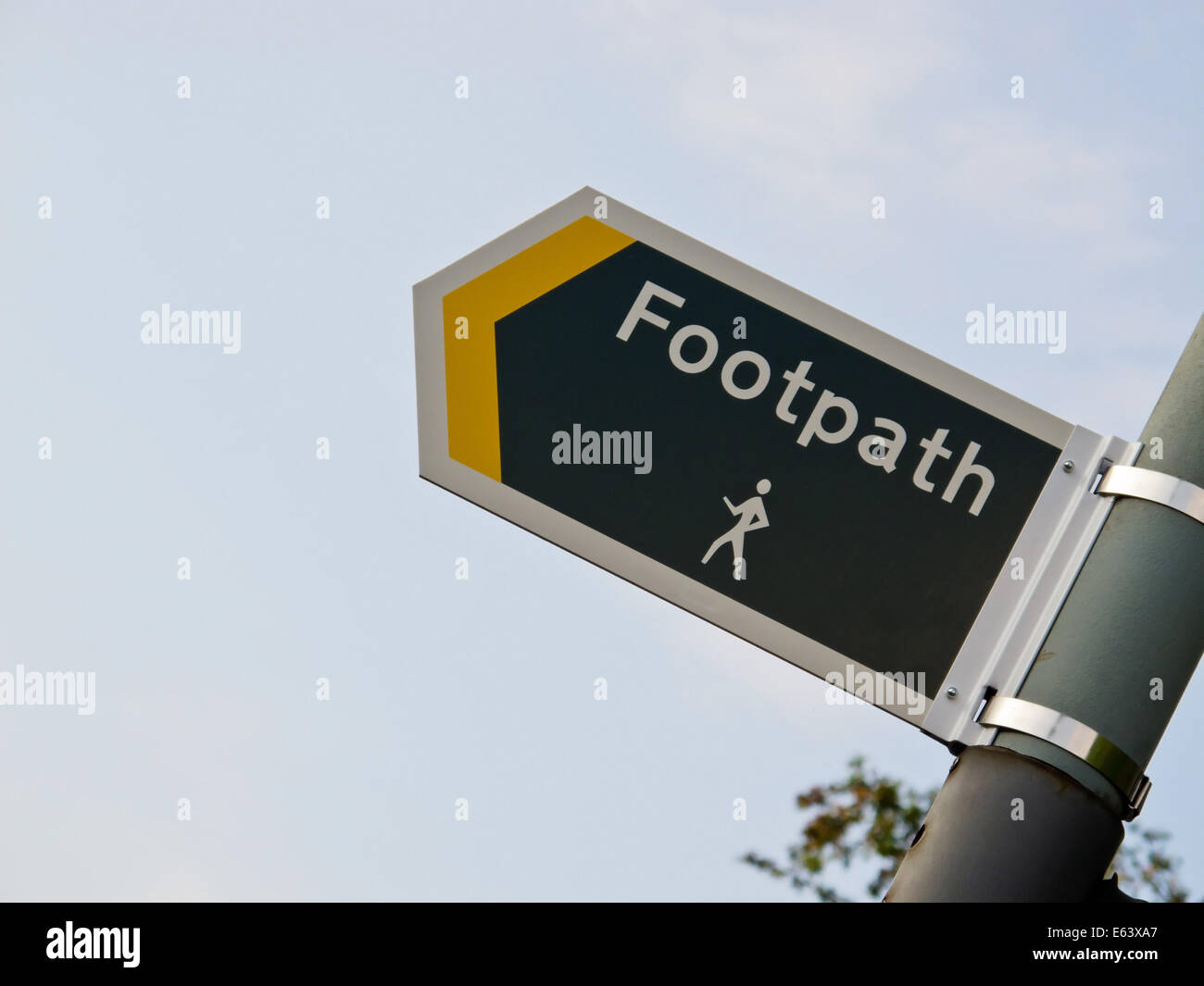 A sign showing a public footpath route Stock Photo - Alamy