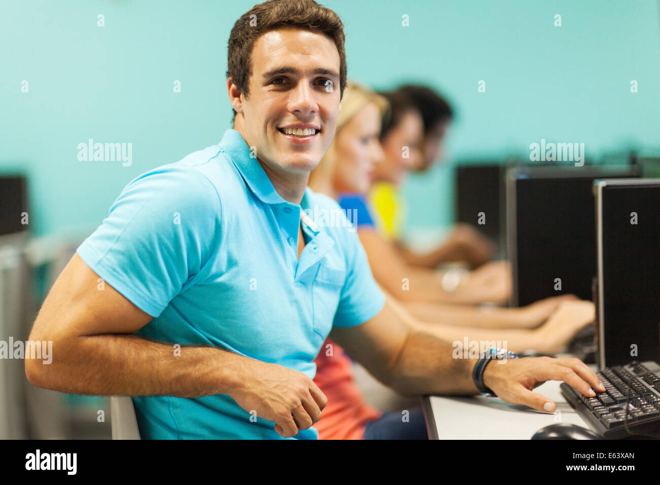 portrait of male college student in computer room Stock Photo - Alamy