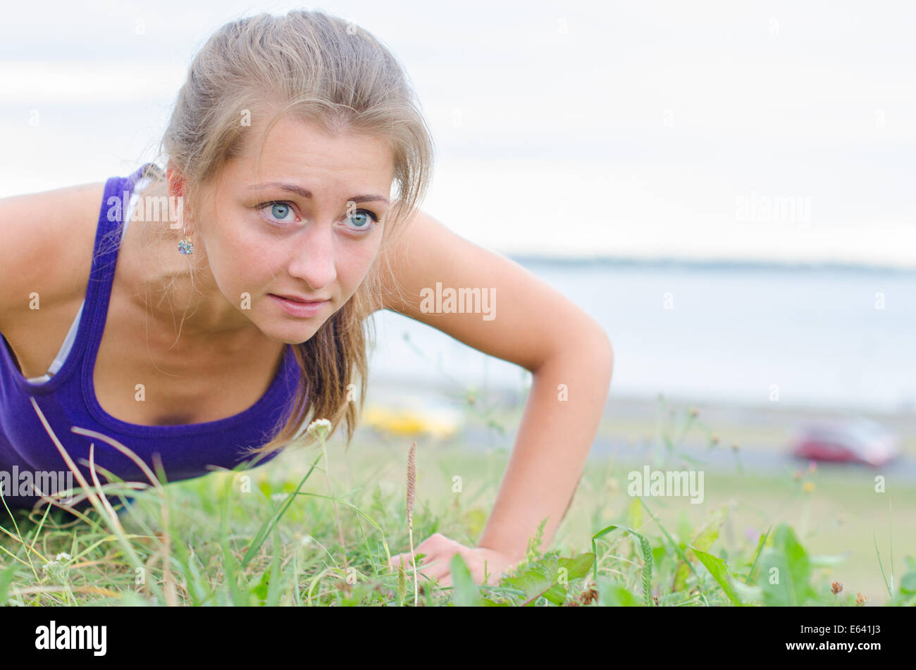 Pretty woman doing push-ups in the park Stock Photo - Alamy