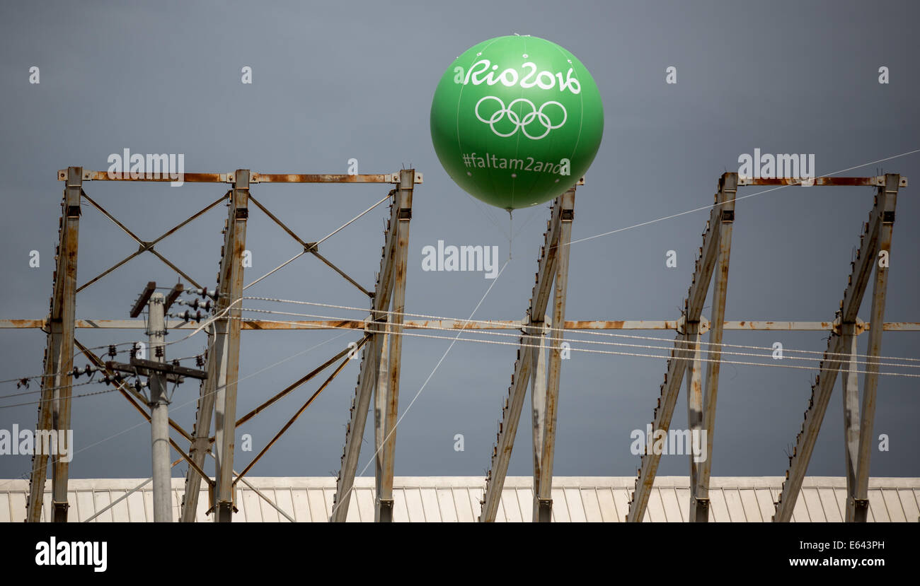 A large green balloon, featuring the writing 'Rio 2016', hovers above ...