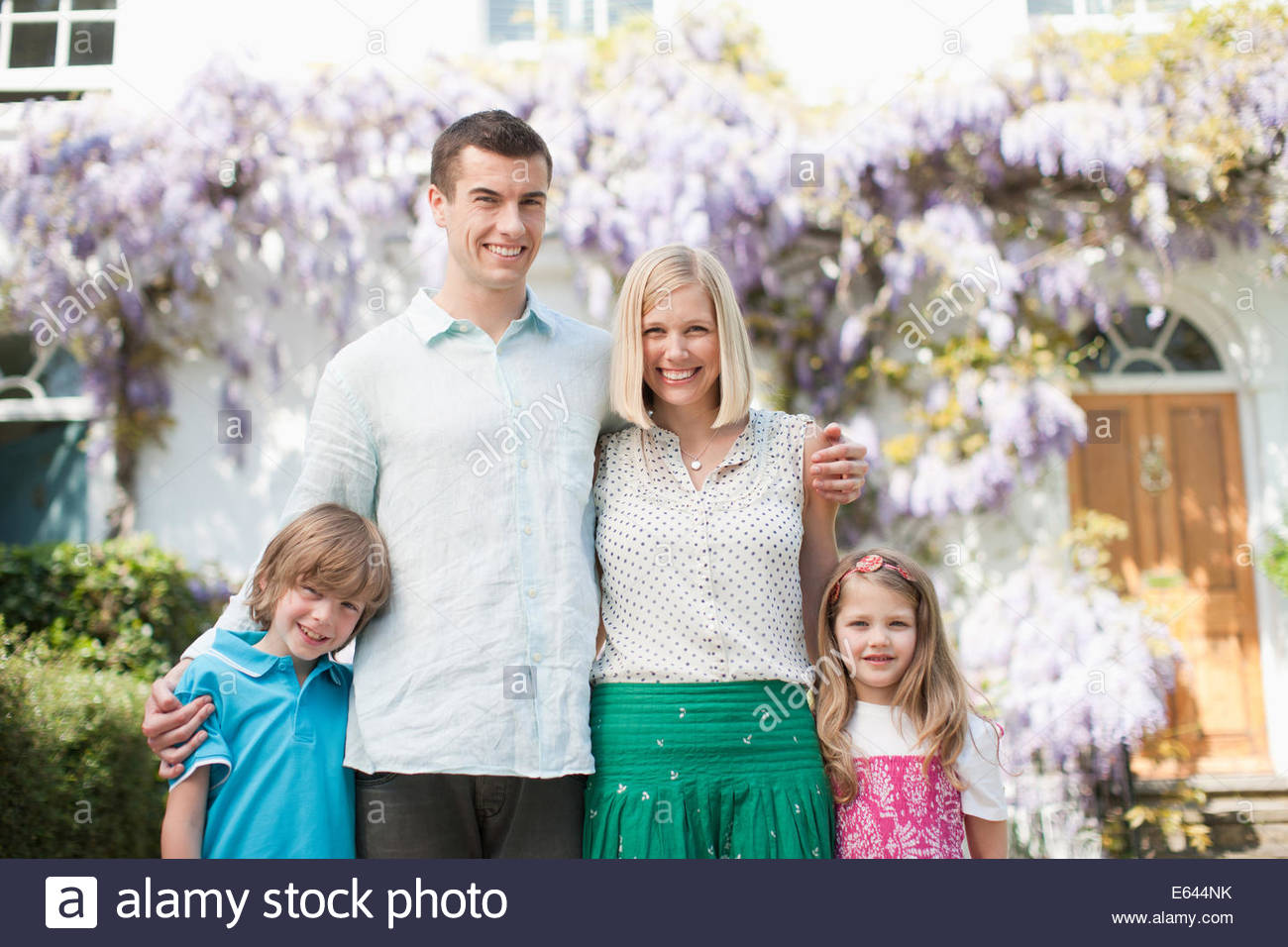 Family Standing Outside Their House Stock Photos & Family Standing ...