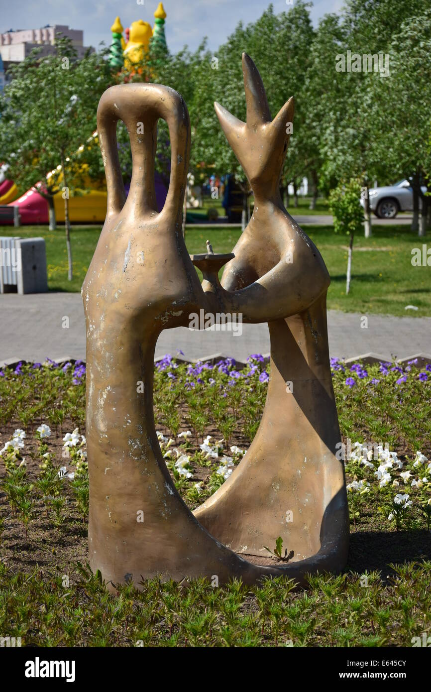 Statue in abstract style featuring a couple holding hands Stock Photo ...
