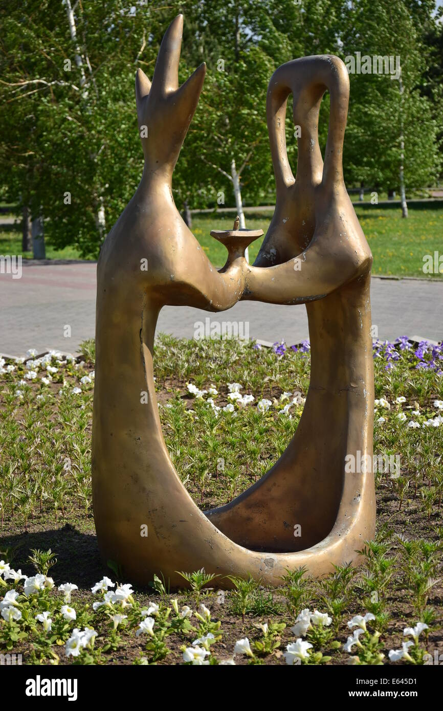 Statue in abstract style featuring a couple holding hands Stock Photo ...