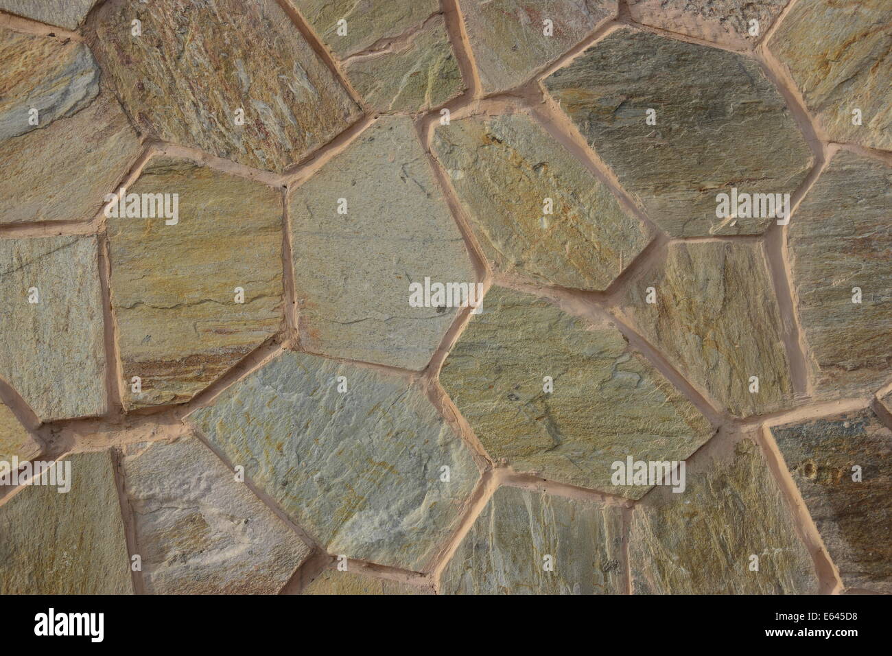 Decorative wall covered with polygonal tiles, to be used as background ...