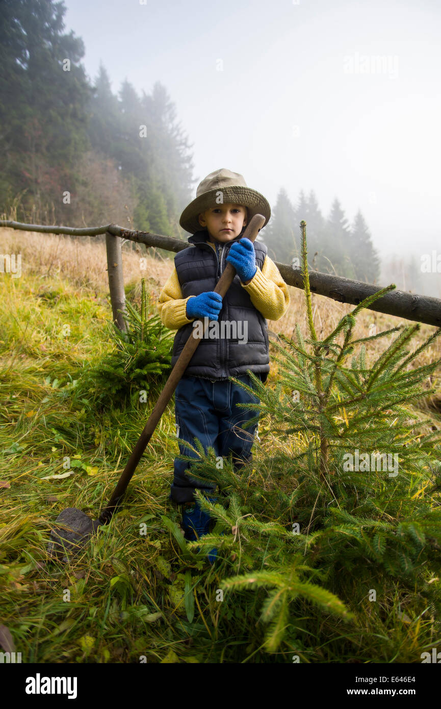young boy with hoe Stock Photo - Alamy
