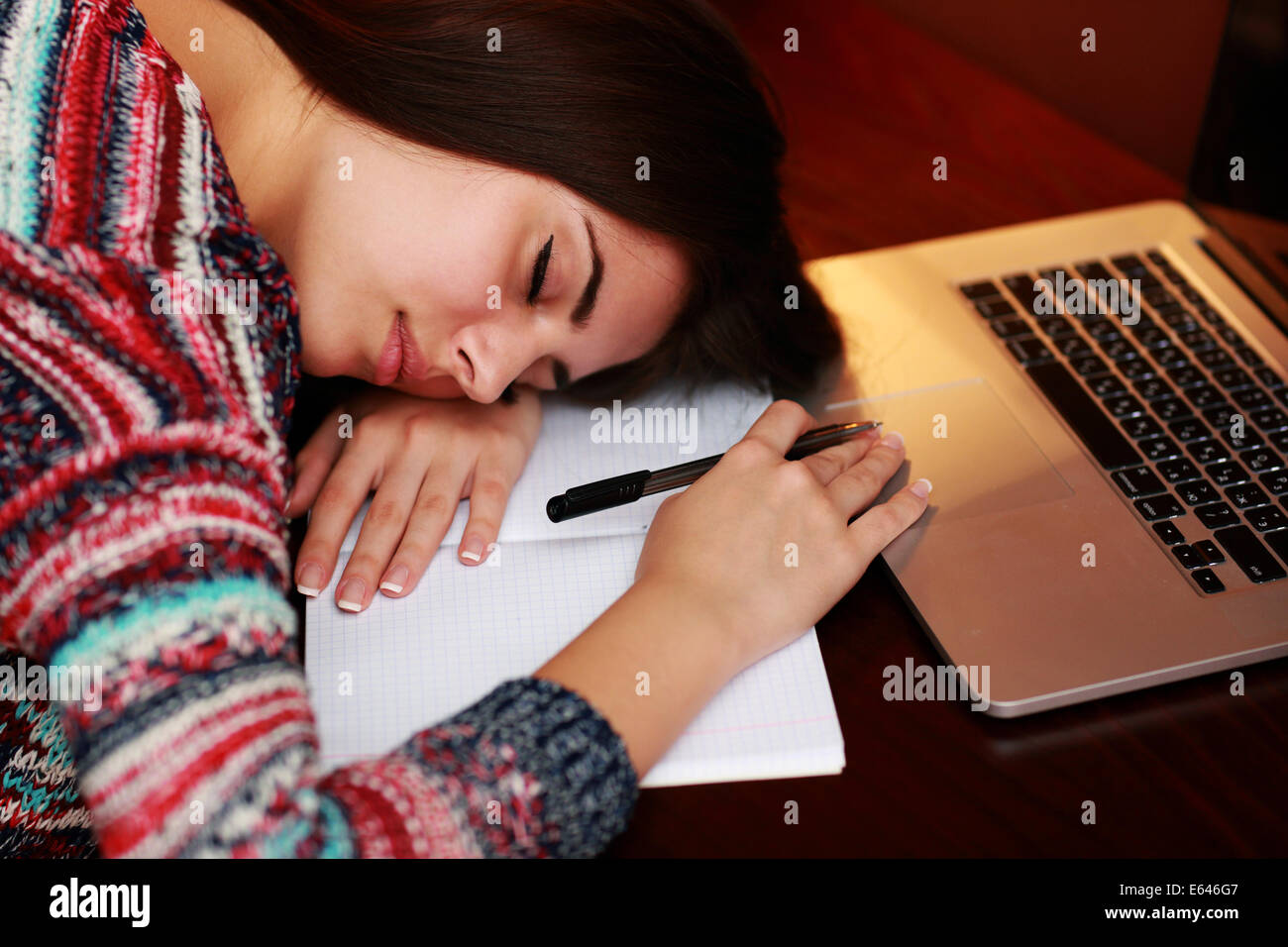 Tired woman sleeping on the table at home Stock Photo - Alamy