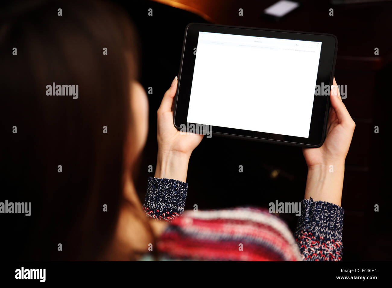 Back view portrait of a woman holding tablet computer Stock Photo - Alamy