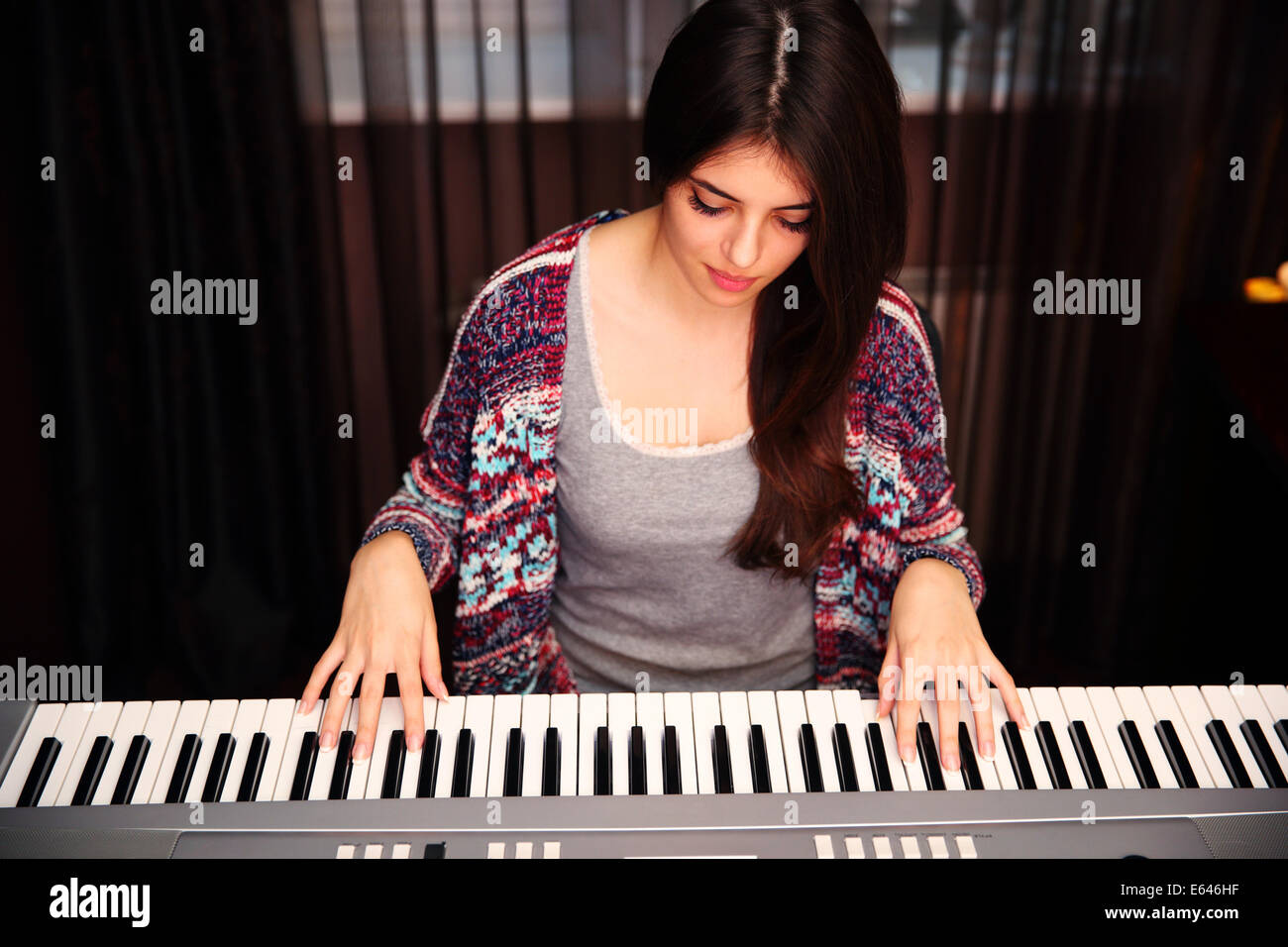 Beautiful young woman playing piano hi-res stock photography and images ...