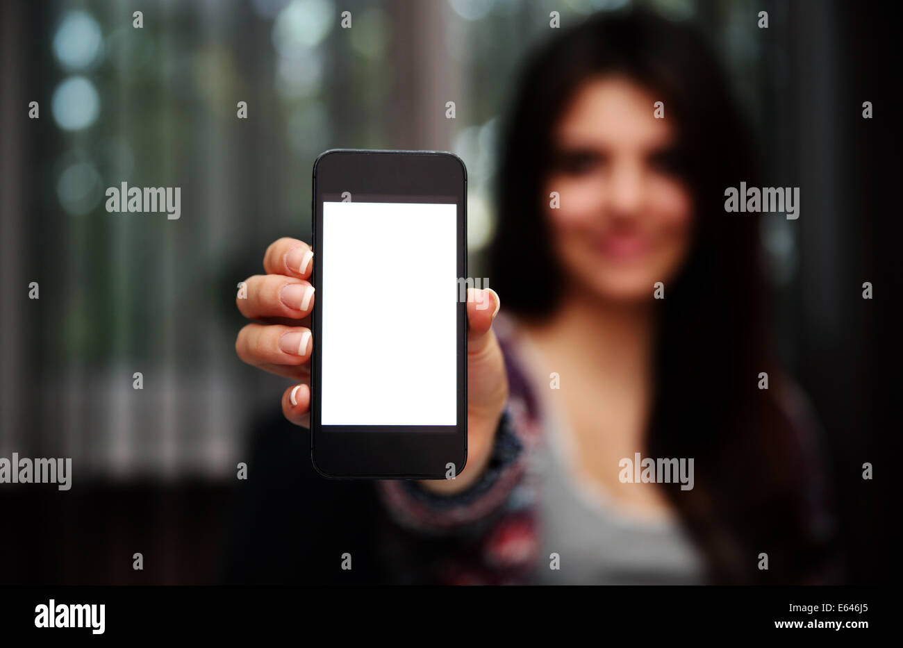 Closeup portrait of a woman showing smartphone screen Stock Photo - Alamy