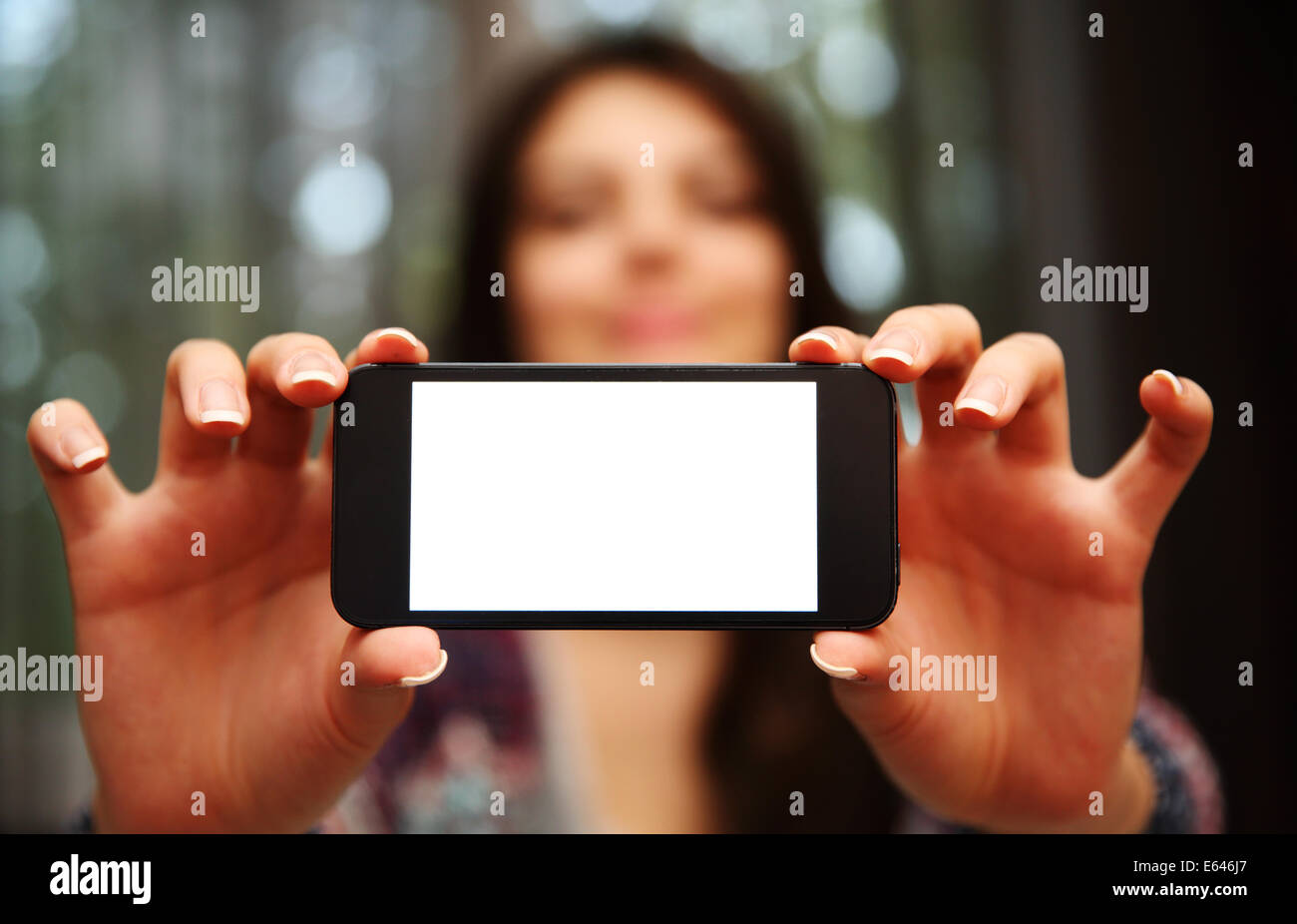Closeup portrait of a woman showing smartphone screen Stock Photo - Alamy