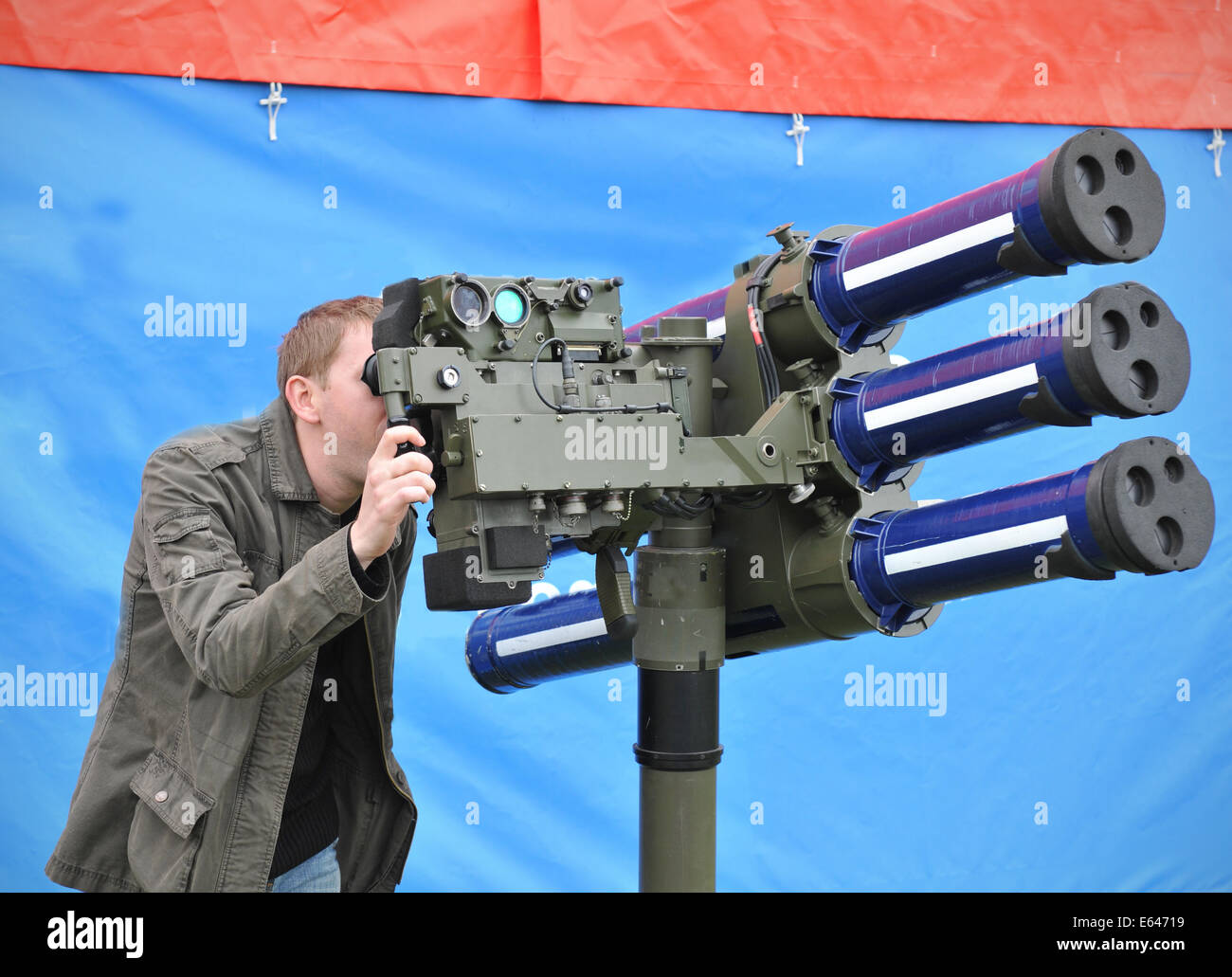 Man testing artillery gun Stock Photo - Alamy