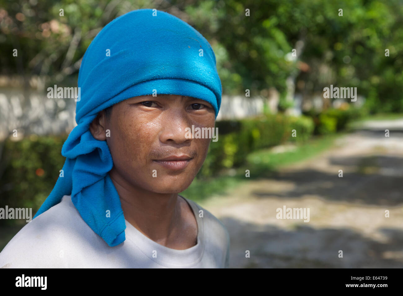 A Burmese man working on a building sight in Phuket Thaialnd Stock ...