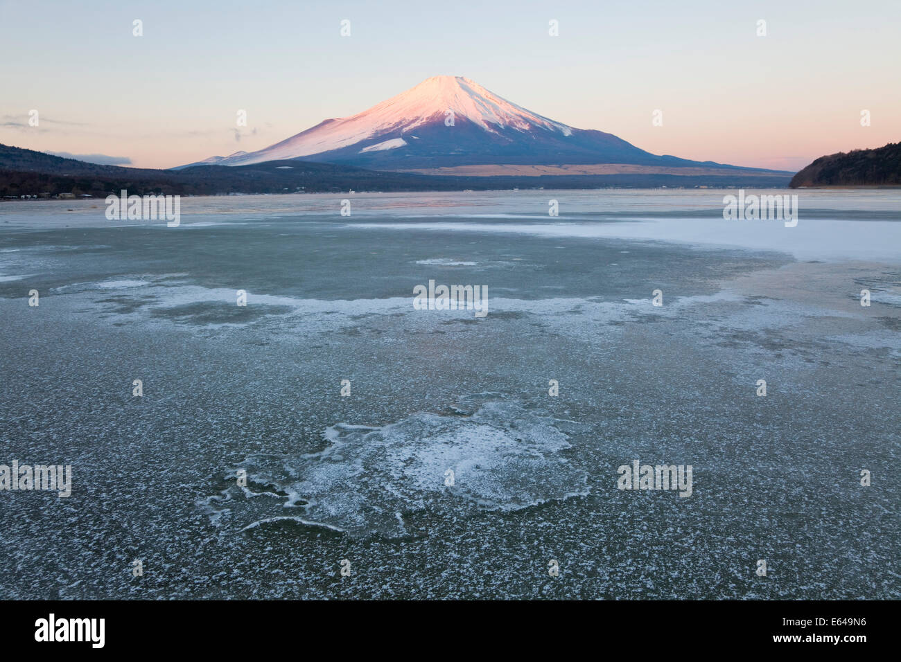 Ice on Lake Yamanaka with snowcovered Mount Fuji in background, Japan ...