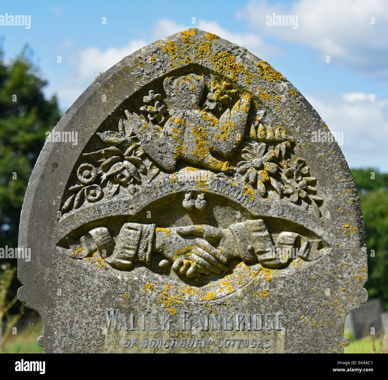 Gravestone with dove and handshake design. Church of Saint Thomas a ...