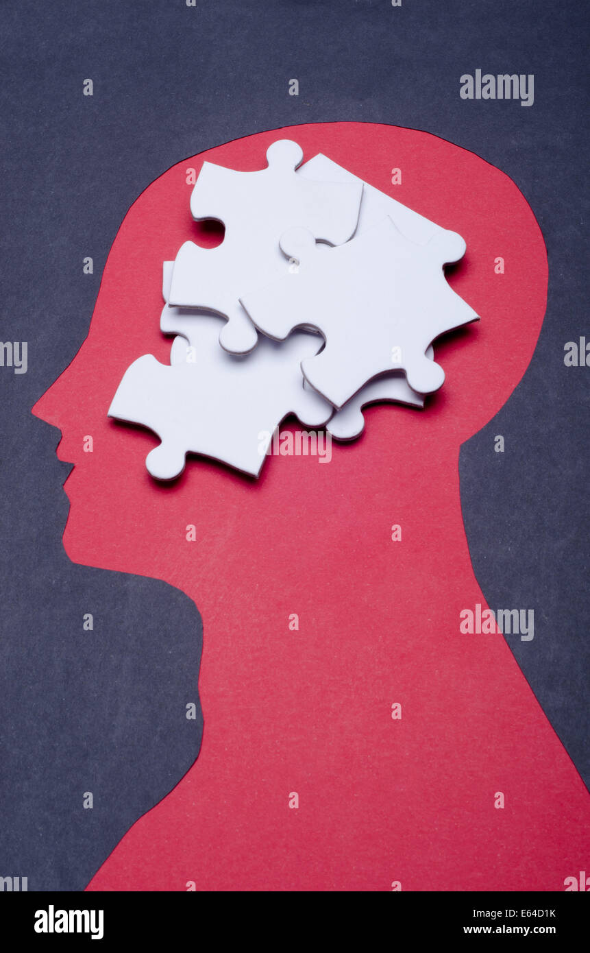 Stacked jigsaw puzzle pieces on the human head Stock Photo - Alamy