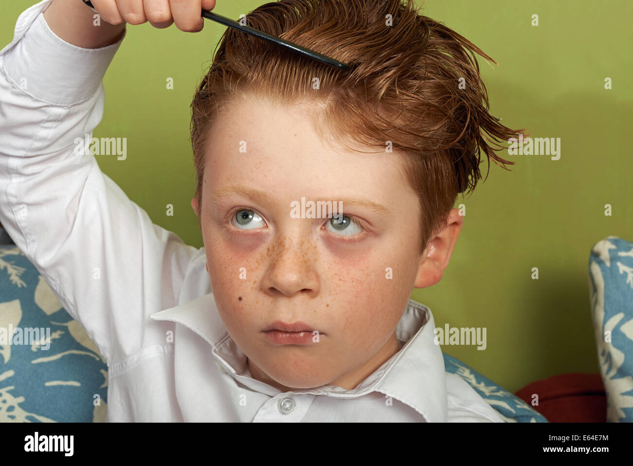 Boy combing hair hi-res stock photography and images - Alamy
