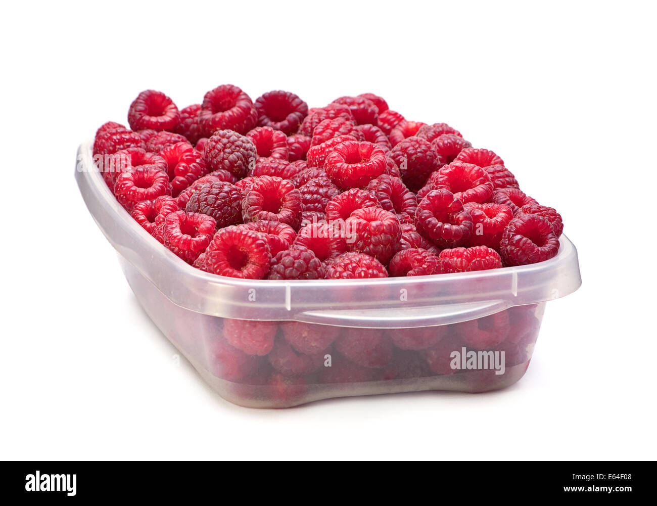 Raspberry in plastic container isolated on white Stock Photo - Alamy