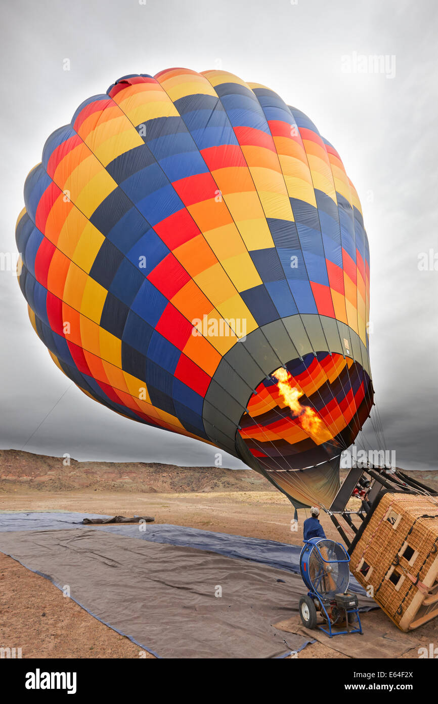 Hot air balloon being inflated for a flight with an on-board gas burner ...