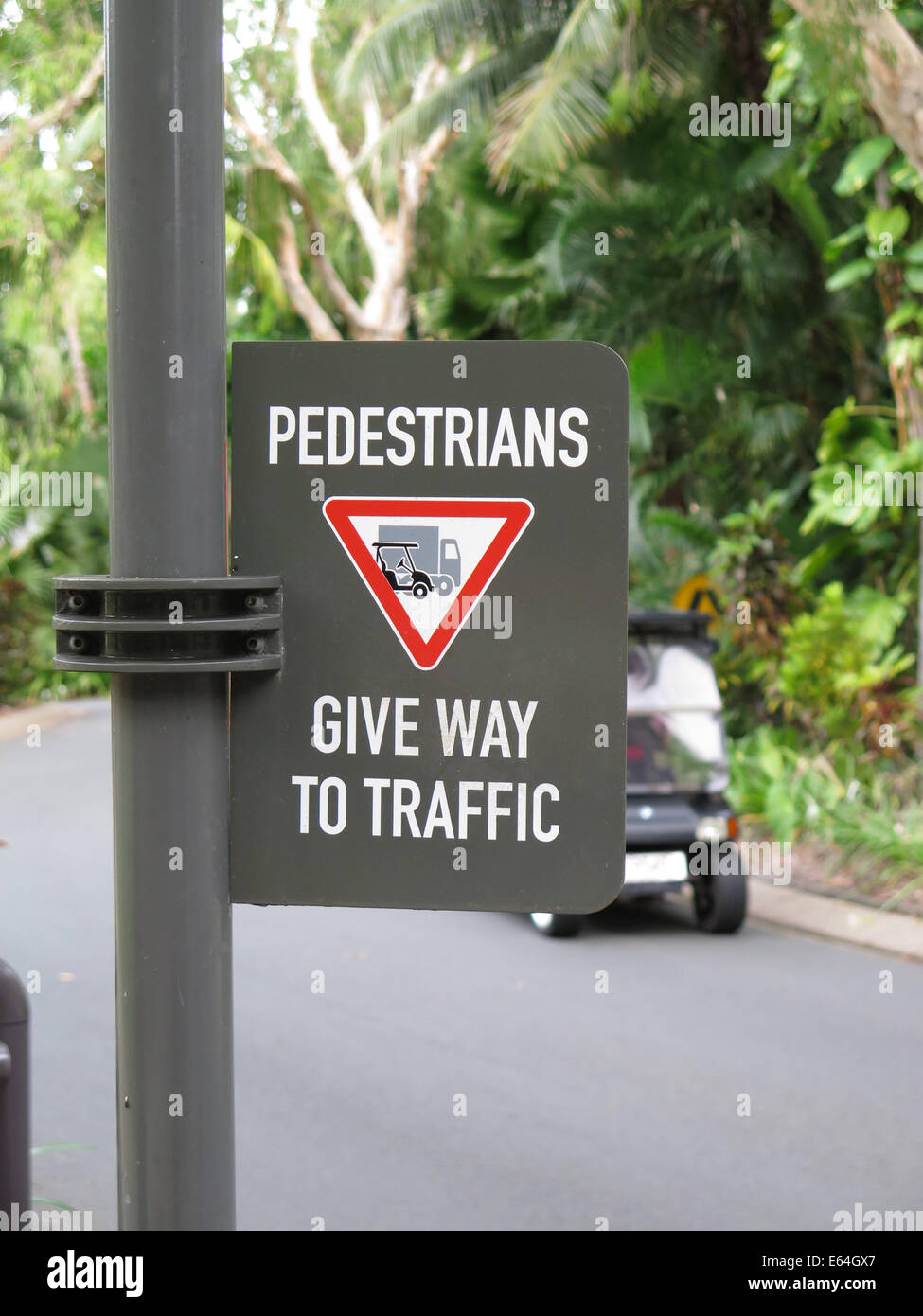 Pedestrians give way to traffic sign on car free Hamilton Island, Great ...