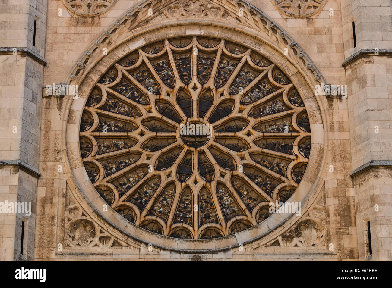 View of the entrance rose window with its stained glasses in the gothic ...