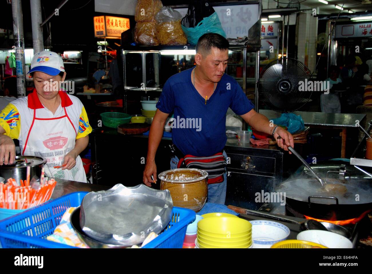 GEORGETOWN, MALAYSIA: Cooks at work in the kitchen of a New Lane ...
