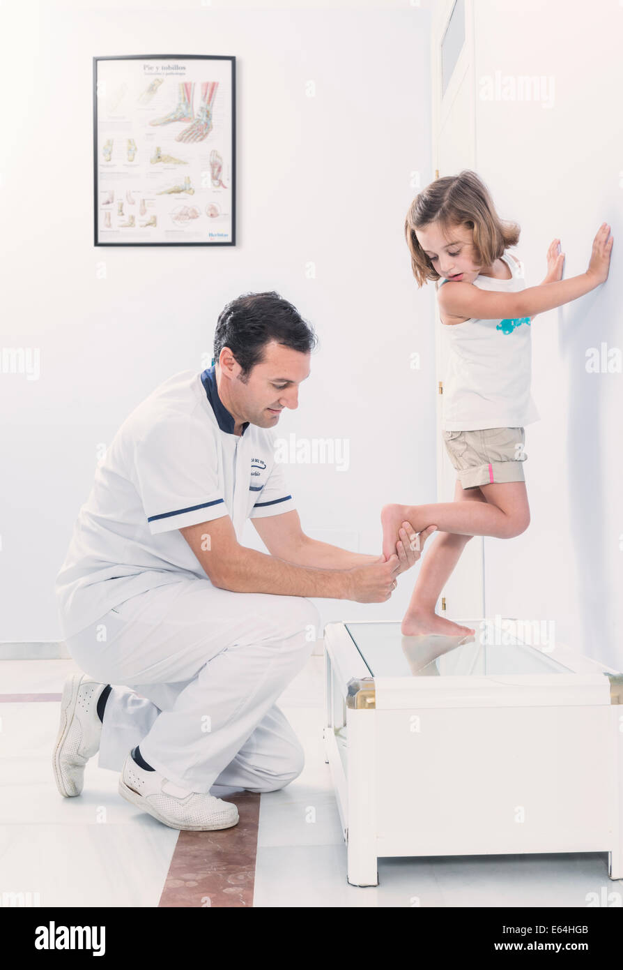 Podologist treating a young girl Stock Photo - Alamy