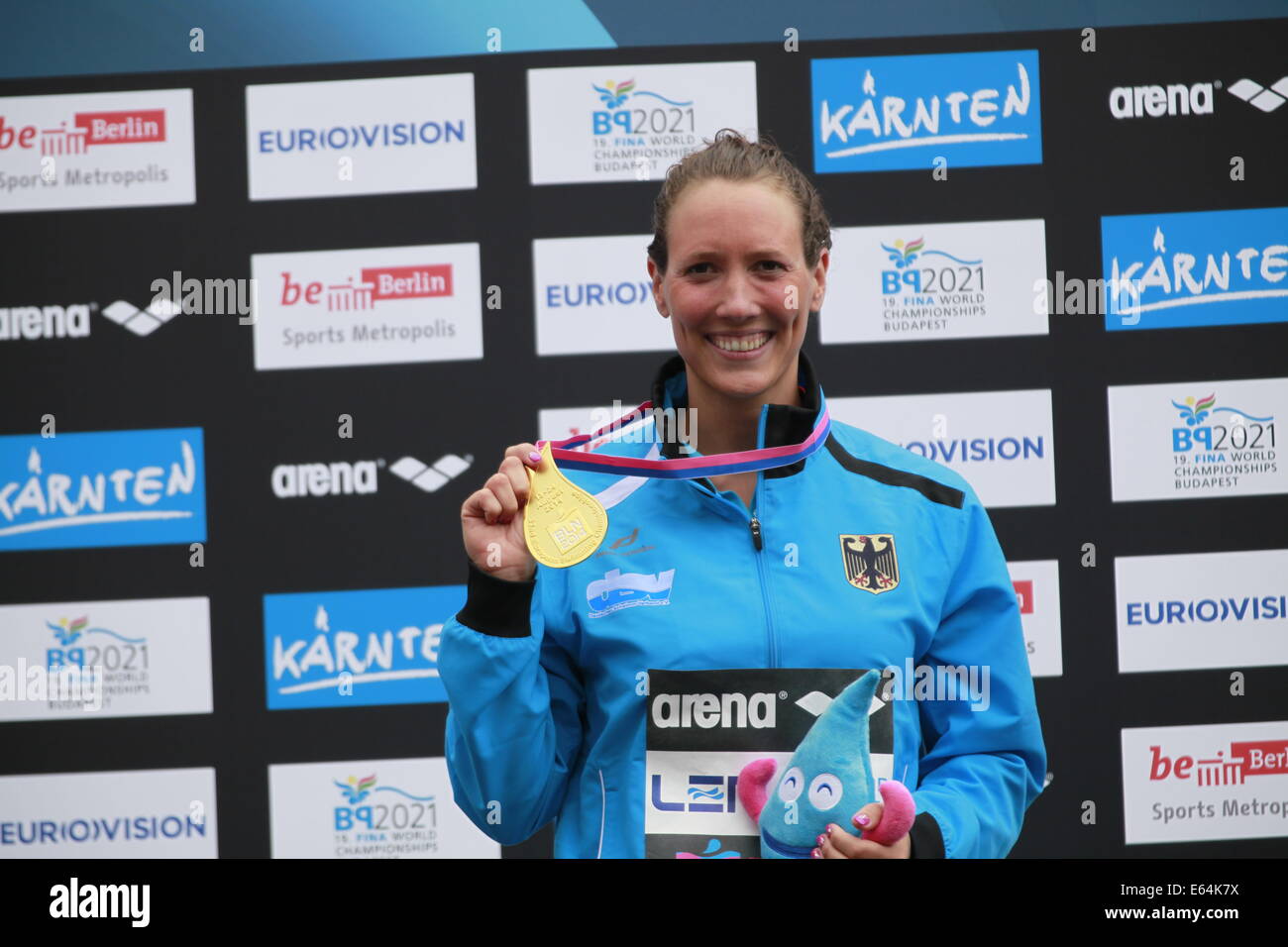 Germany's Isabelle Harle (C) during the awarding of the women's 5km ...
