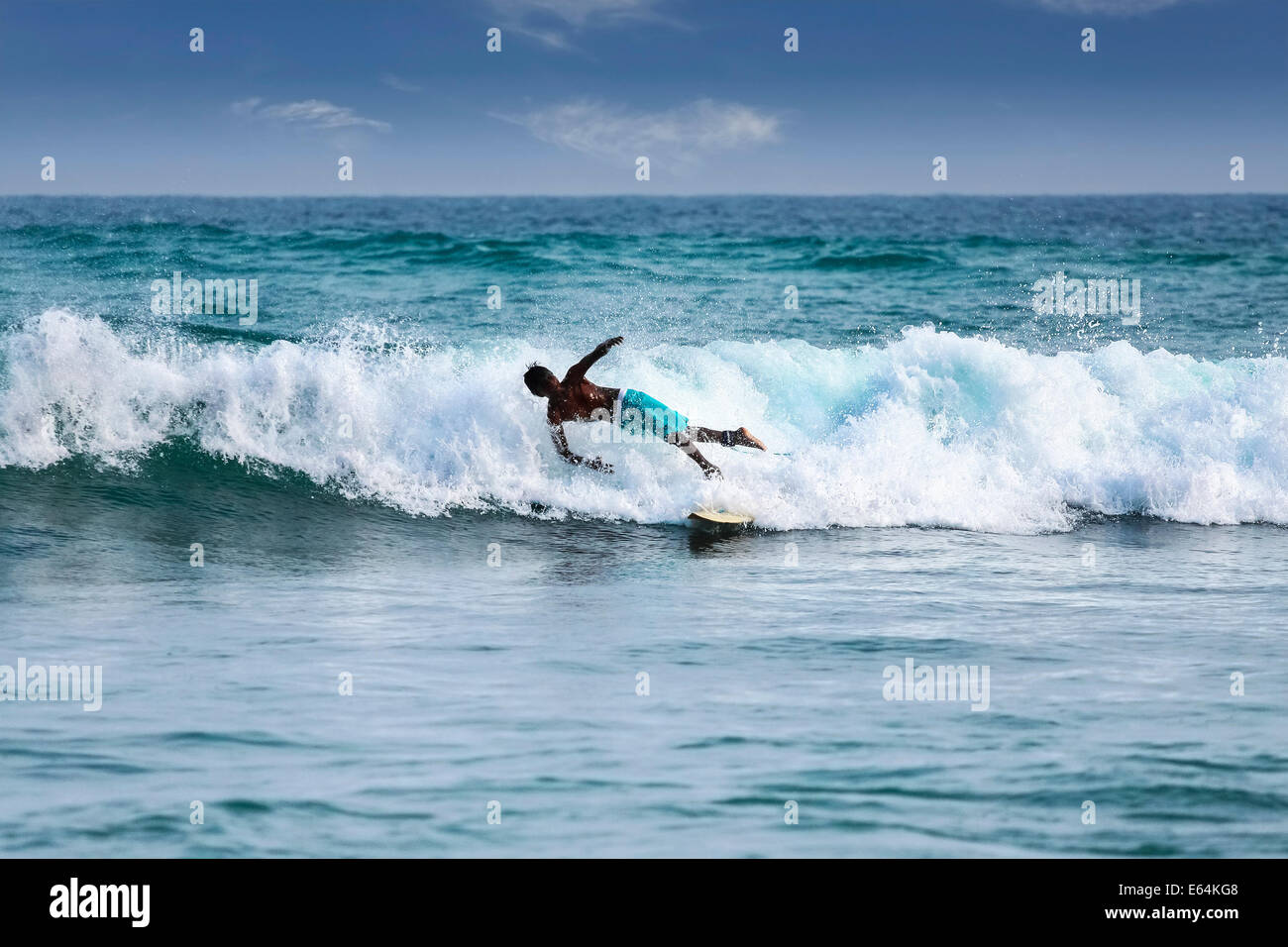 Silhouette of a surfer falling off the board on waves in famous beach ...
