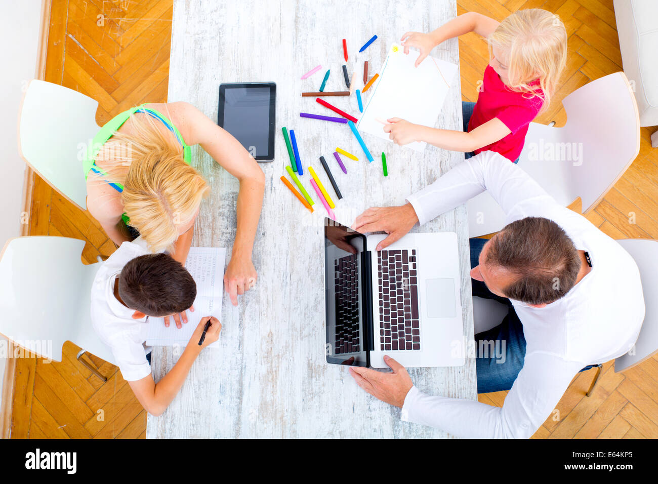 A family performing various activities at home Stock Photo - Alamy