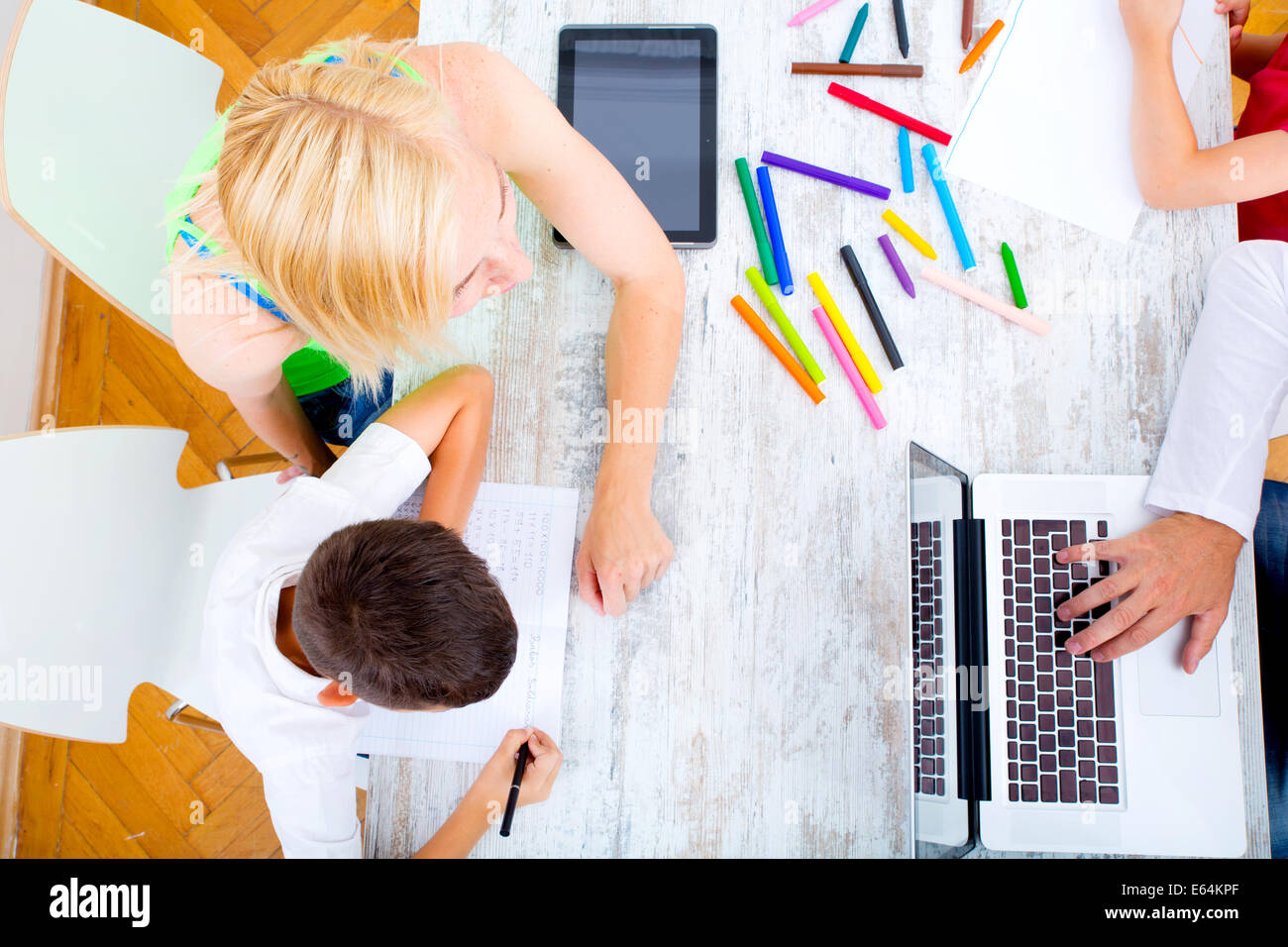 A family performing various activities at home Stock Photo - Alamy