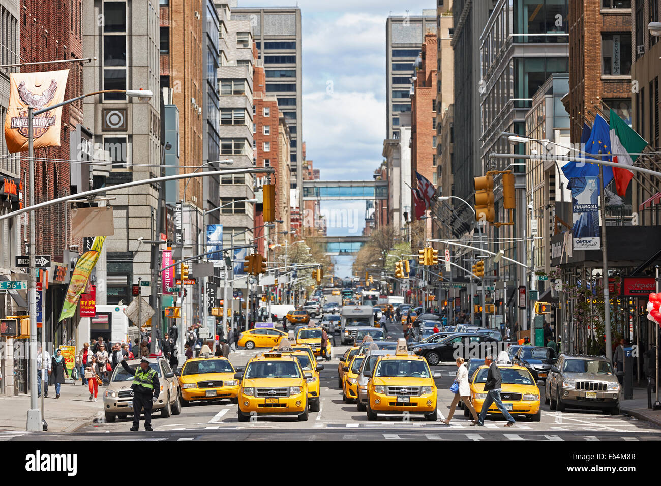 Yellow Medallion taxi cabs stopped to give way to pedestrian traffic in ...