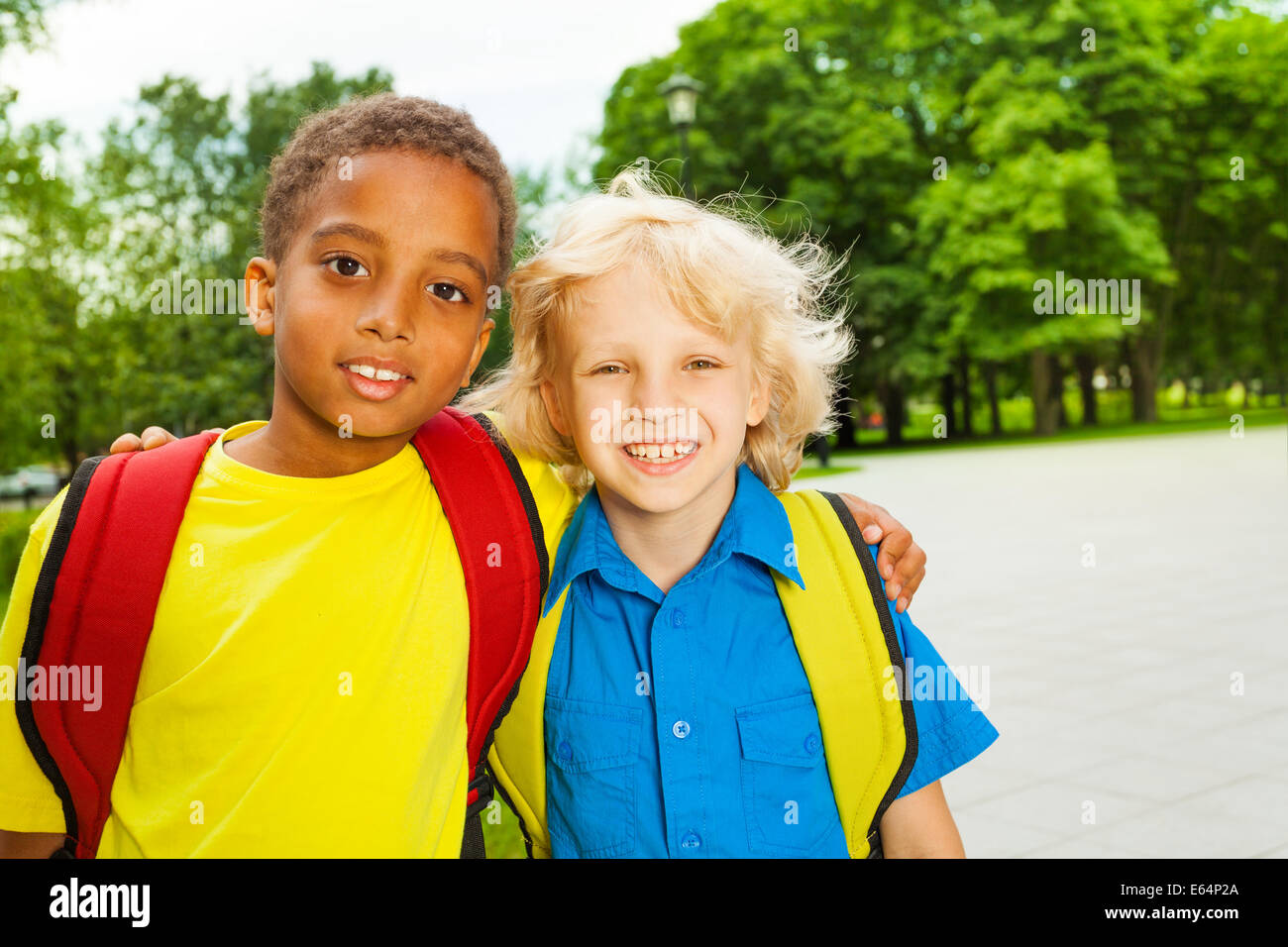 Portrait of two boys hugging on shoulders Stock Photo - Alamy