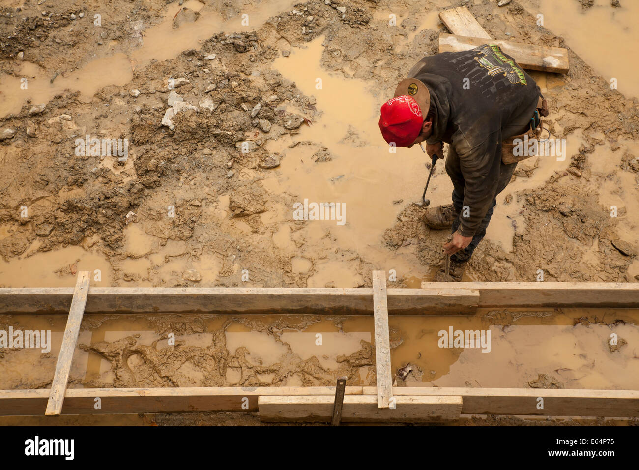 Construction workers digging out foundation hi-res stock photography ...