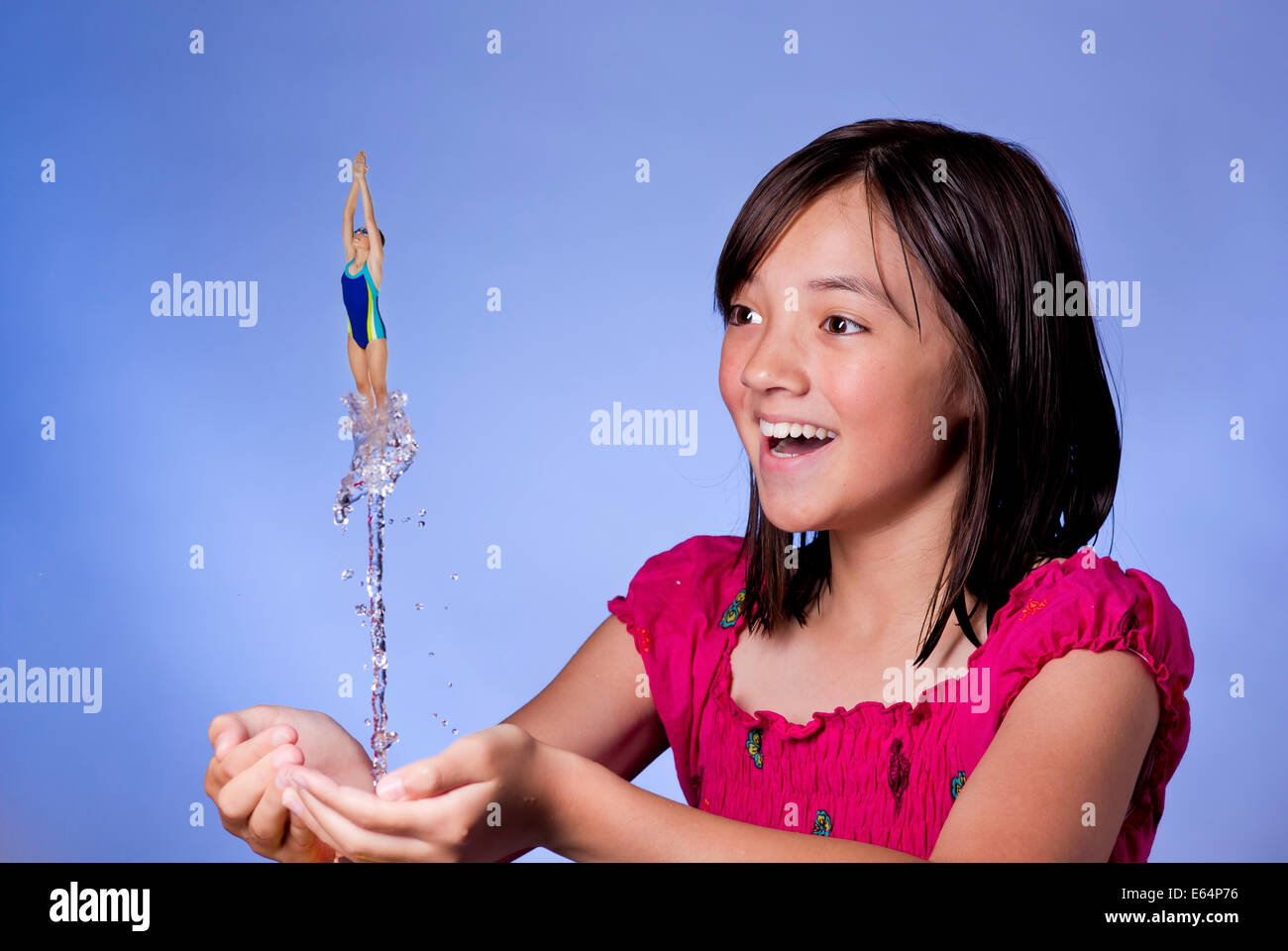 Mini diver shoots from water Stock Photo - Alamy