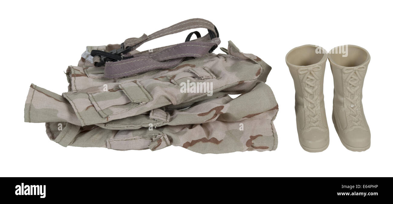Folded soldier military clothes of brown camouflage material with boots ...