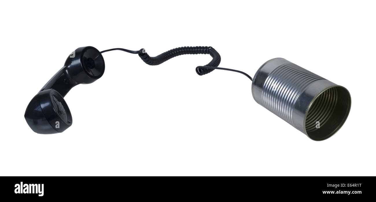 Traditional desk phone handset connected to a tin can to show phone ...