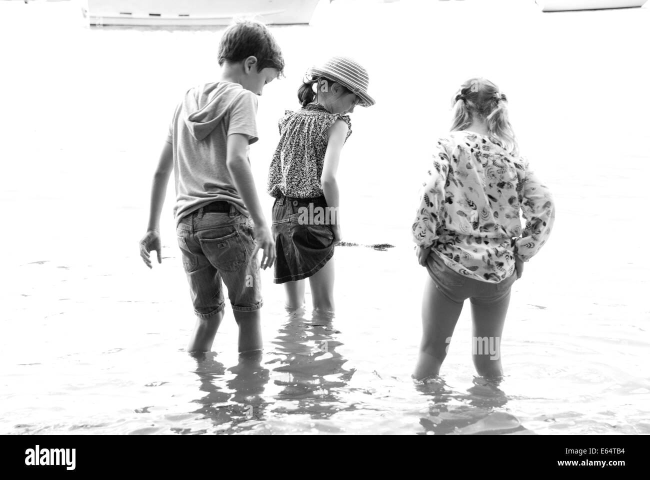 Boy Wading Into Water High Resolution Stock Photography and Images - Alamy