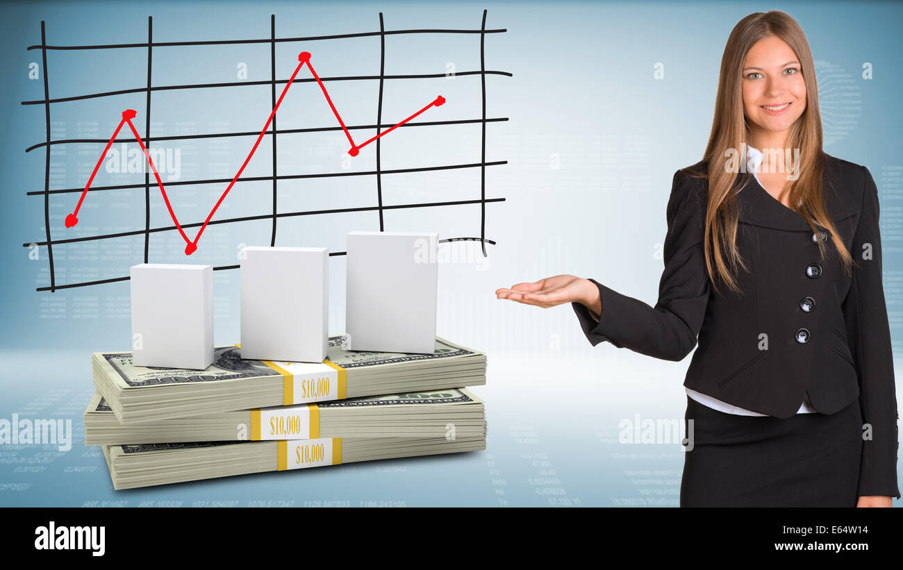 Businesswoman points hand on white boxes and money Stock Photo - Alamy